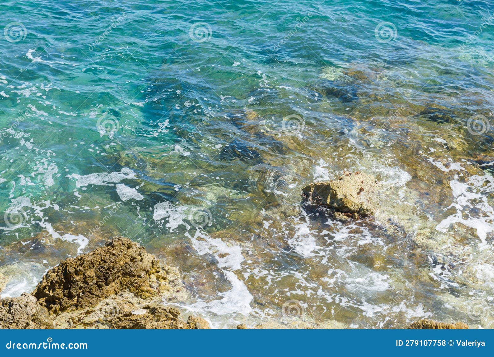 Beach with rocks in water stock photo. Image of coastline - 279107758