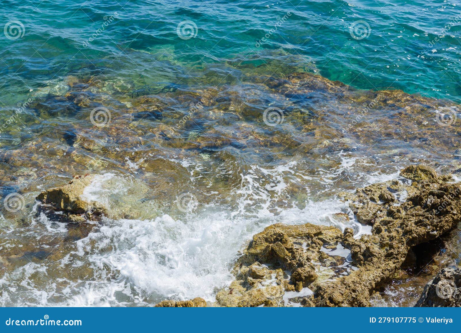 Beach with rocks in water stock image. Image of coast - 279107775