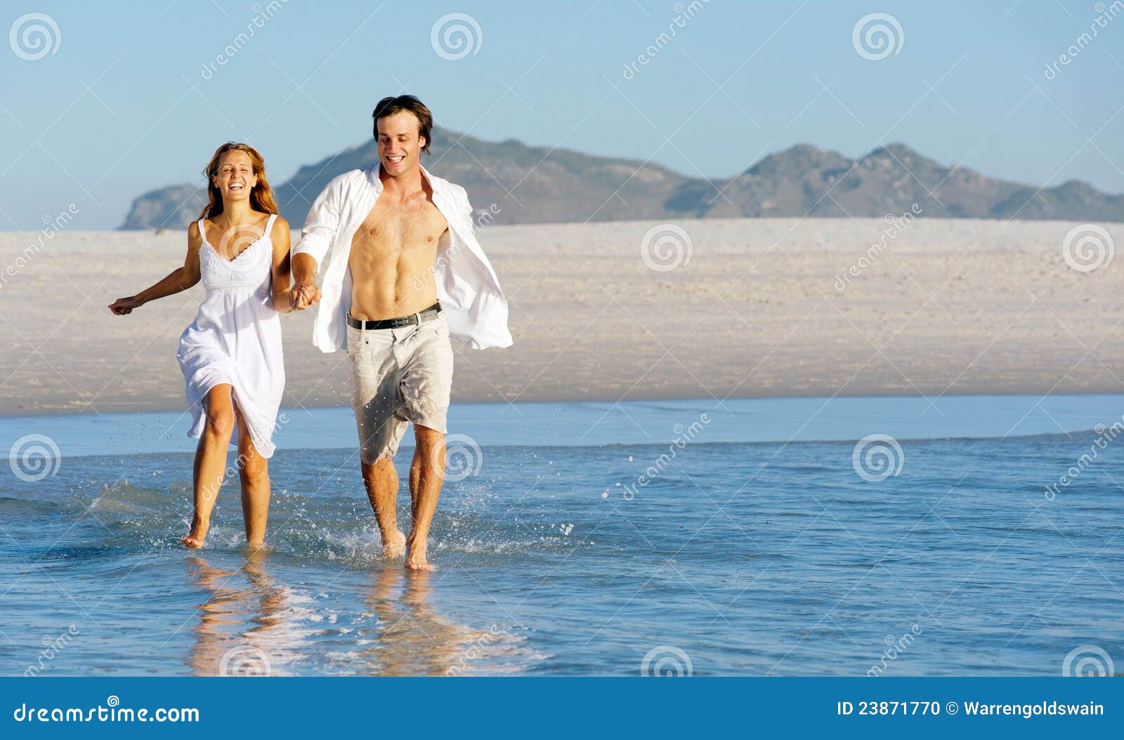 Beach run splash couple stock photo. Image of happiness - 23871770