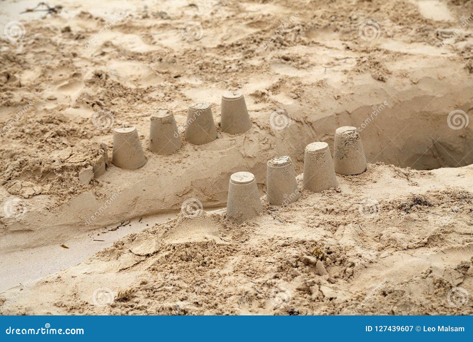 Sand games on the beach stock image. Image of water - 127439607