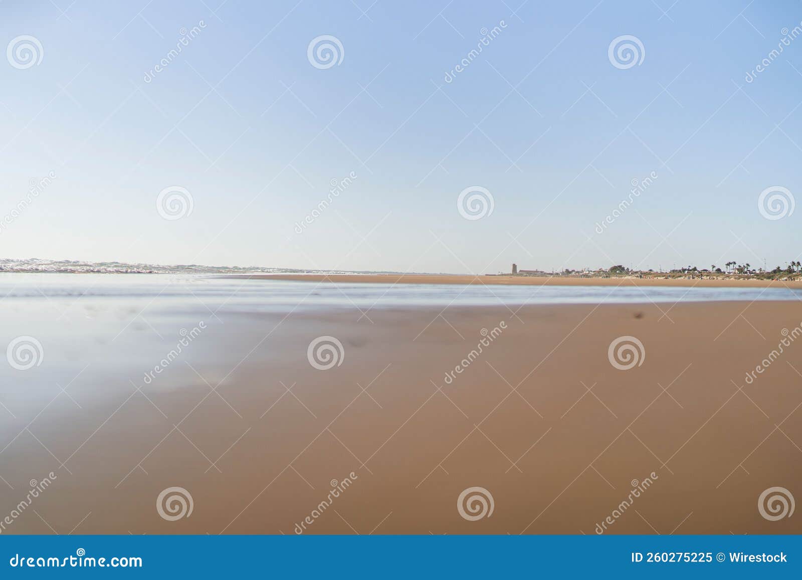 Beach Sand and Water Under the Bright Blue Sky on a Sunny Day Stock ...