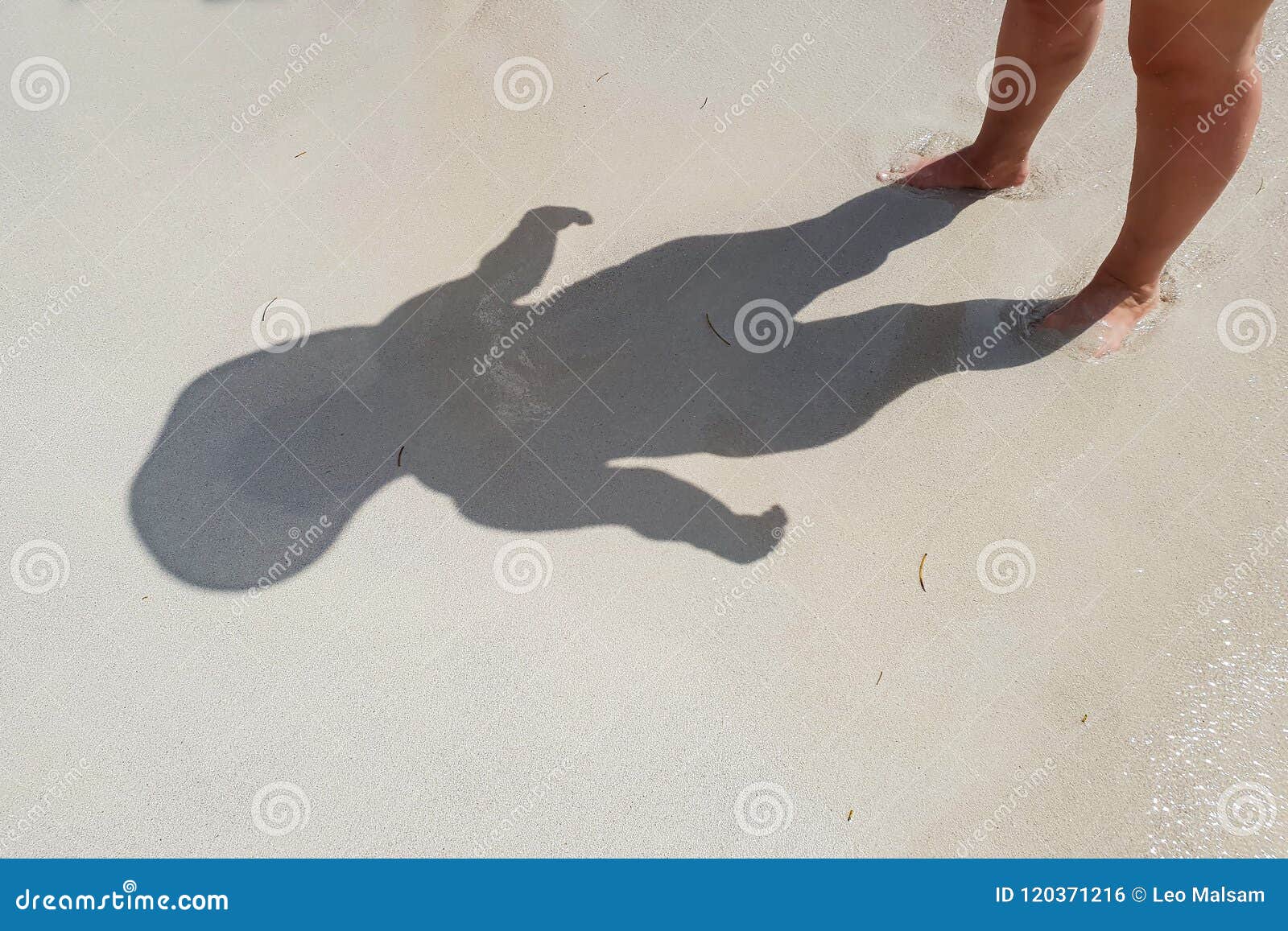 Beach / shadow on the sand stock photo. Image of woman - 120371216