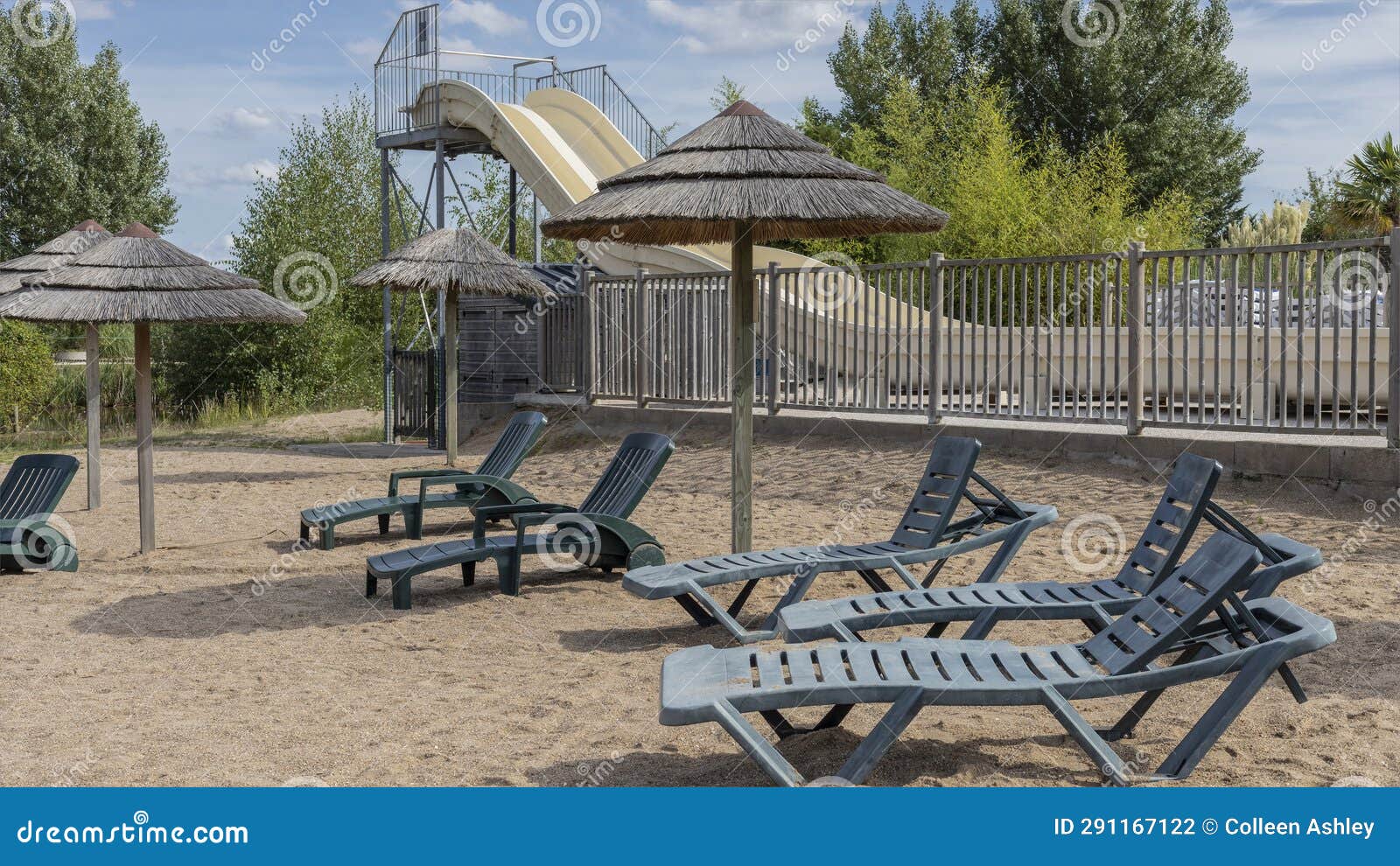 Beach by the Side of a Pool with Water Silde Stock Photo - Image of ...