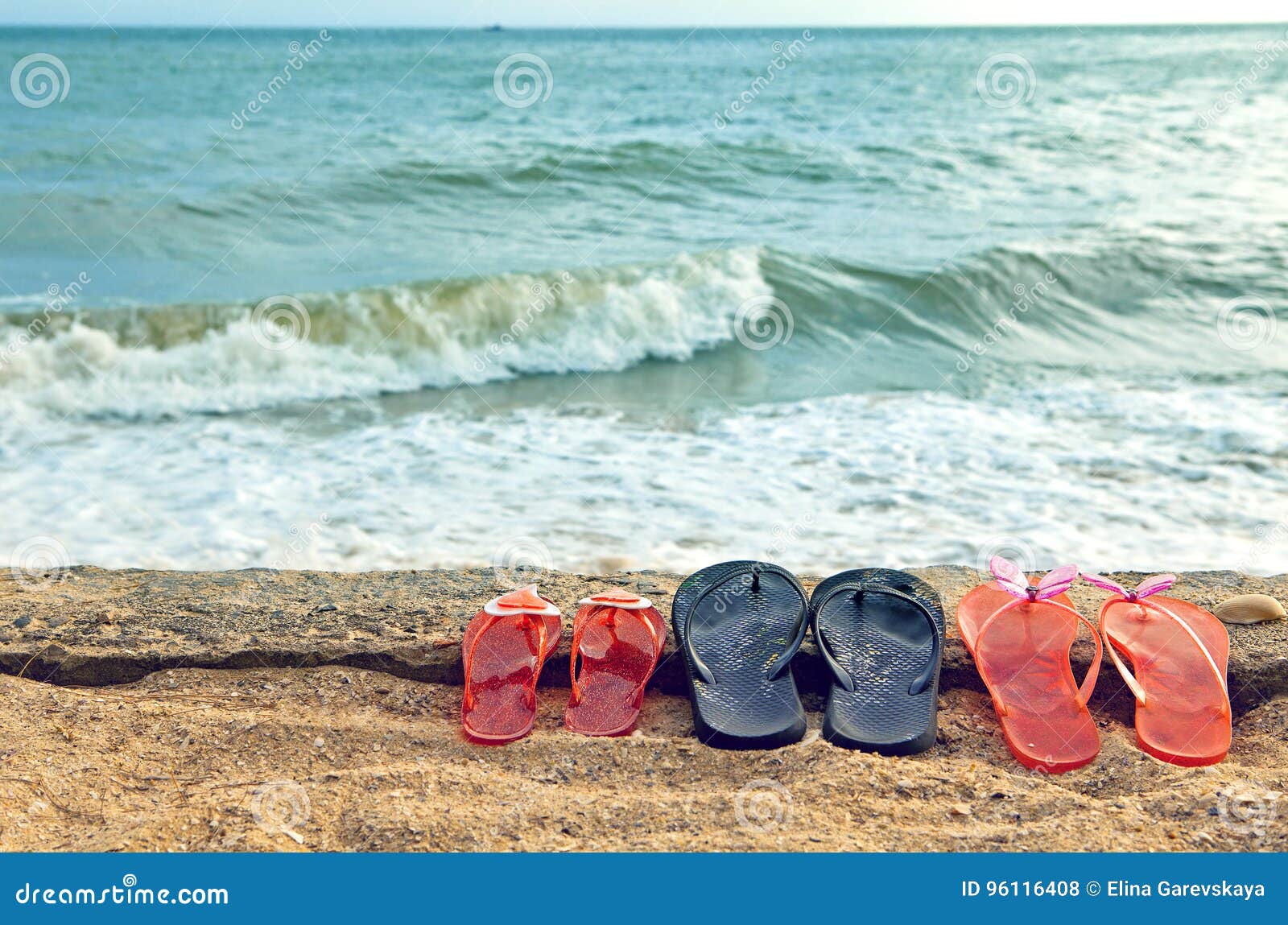 Beach Slippers on the Sand Against the Sea Stock Photo - Image of leave ...
