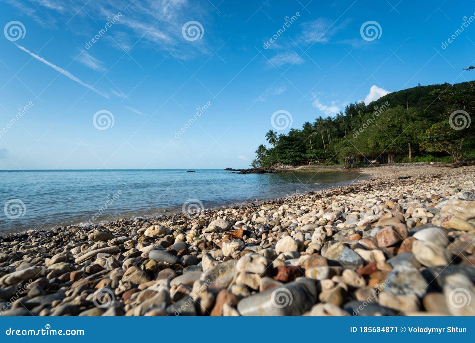 Beach with a Small Rocks with a Palm Trees on a Horizon. Stock Image ...