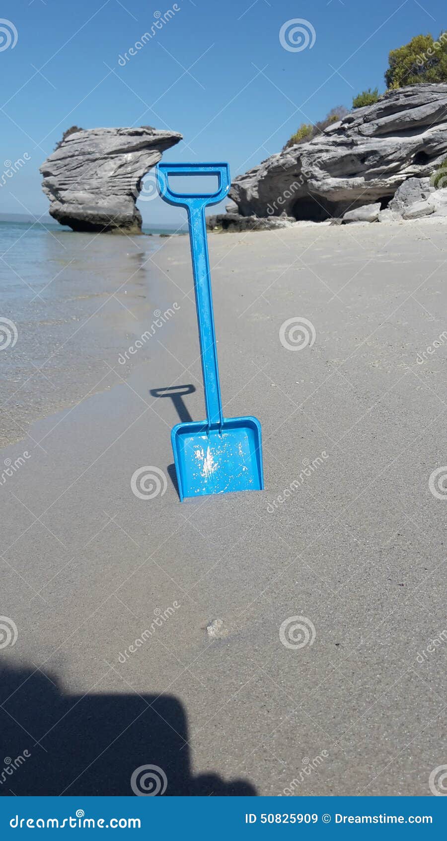 Beach spade stock image. Image of spade, blue, rocks - 50825909