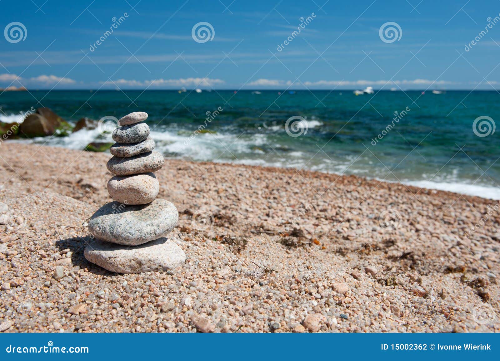 Beach with stacked stones stock photo. Image of stacked - 15002362