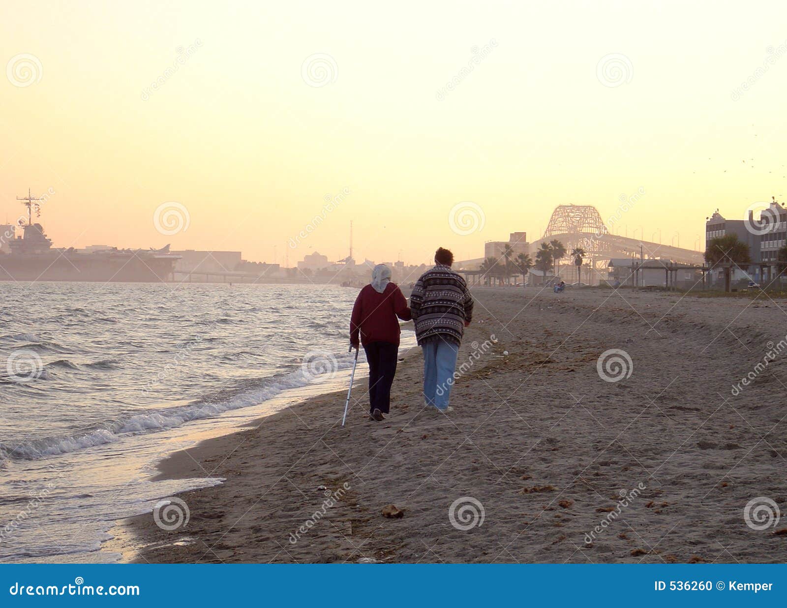 Beach Stroll stock photo. Image of walk, couples, water - 536260