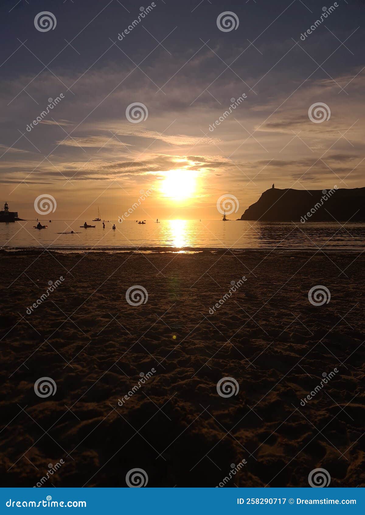 Beach sun set stock image. Image of sunlight, blue, reflection - 258290717