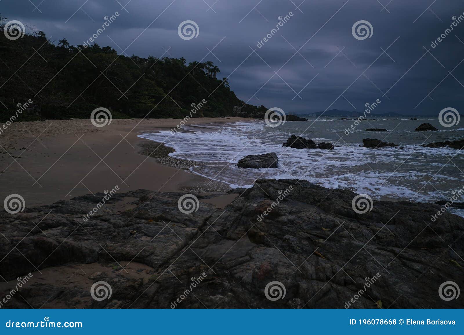 The beach at sunset clouds stock photo. Image of shore - 196078668