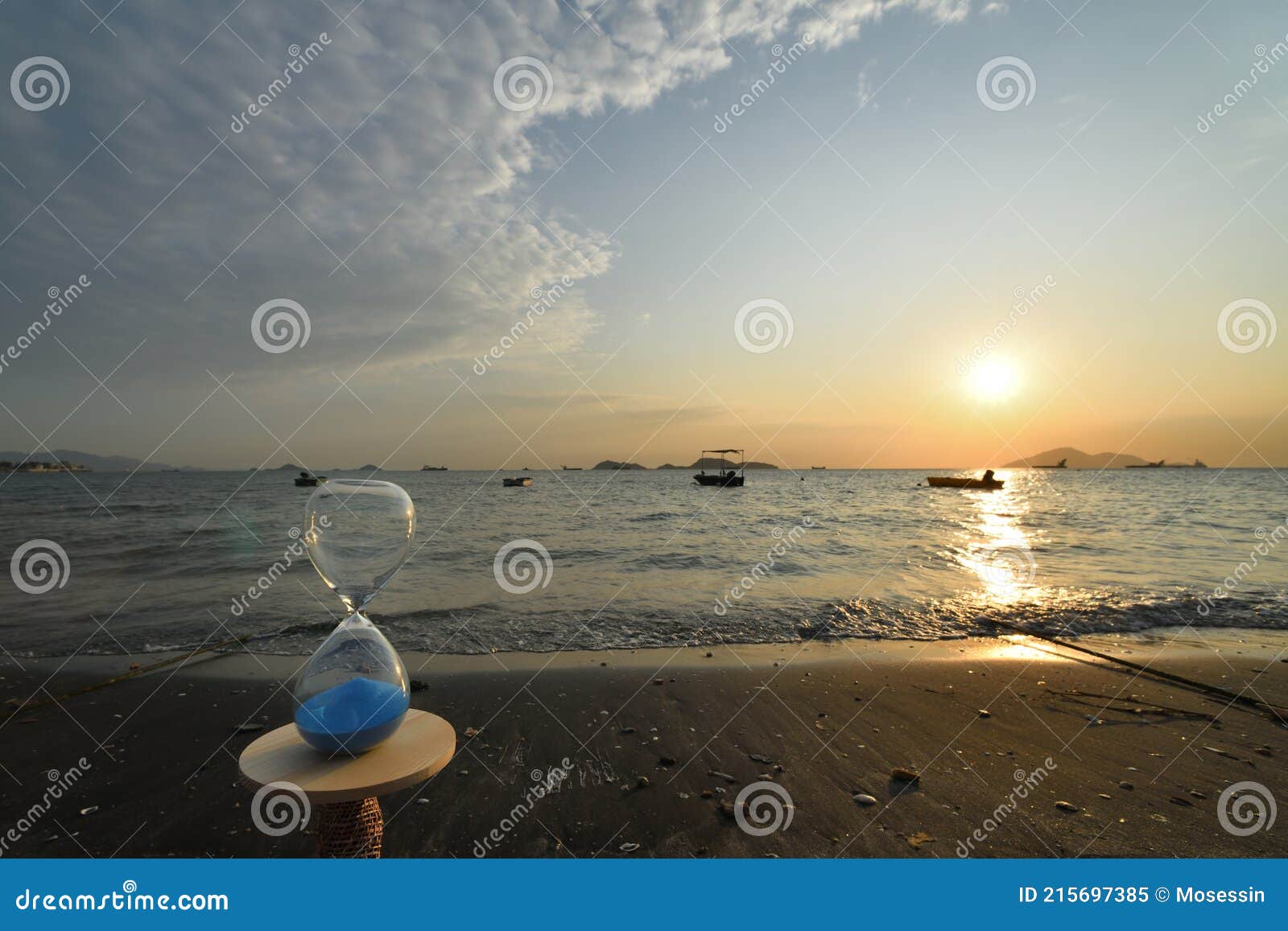 Beach sunset sand timer stock image. Image of layer - 215697385