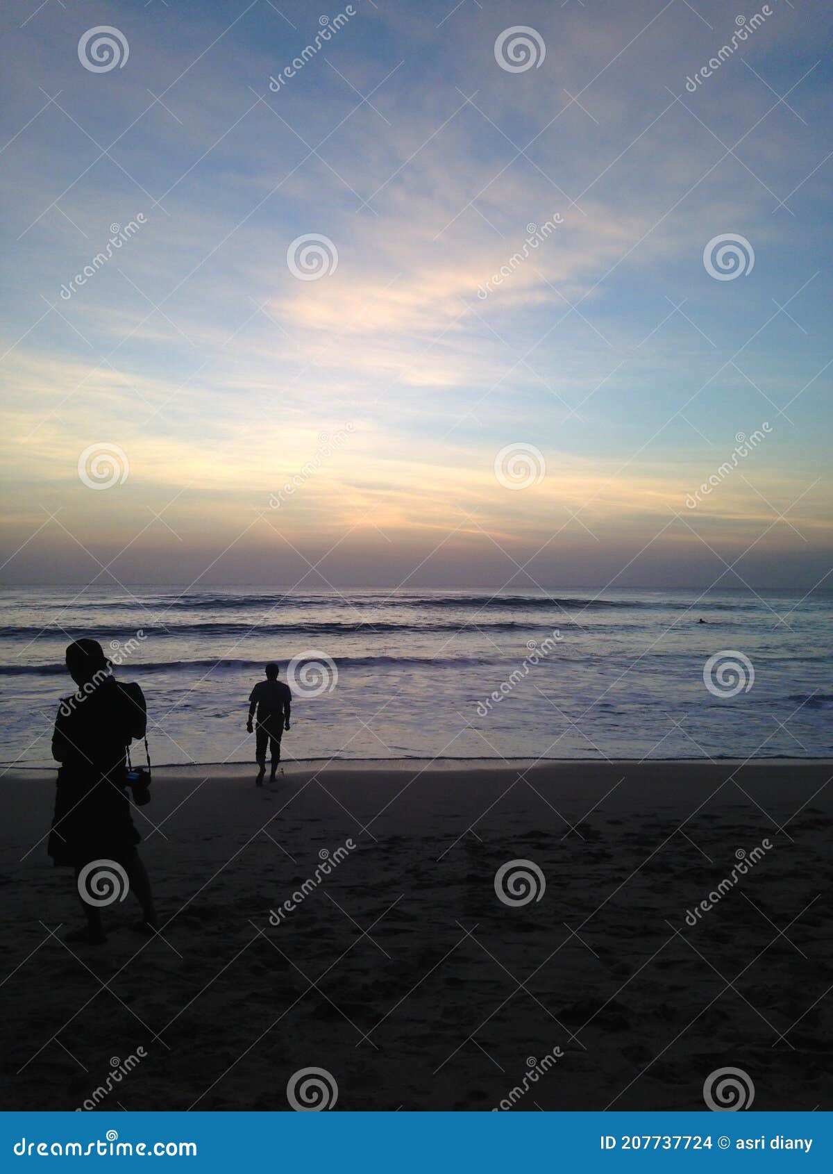 Beach stock photo. Image of sunset, clouds, human, beach - 207737724
