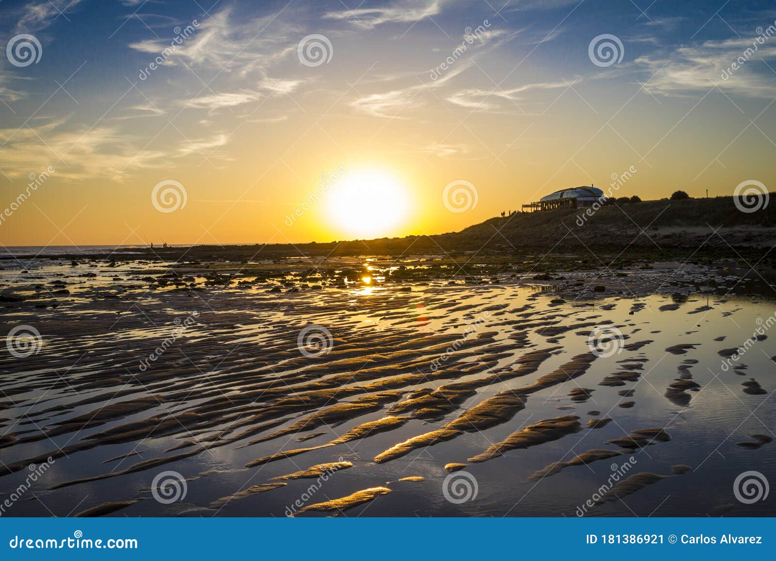 Beach at sunset with water stock image. Image of harbor - 181386921