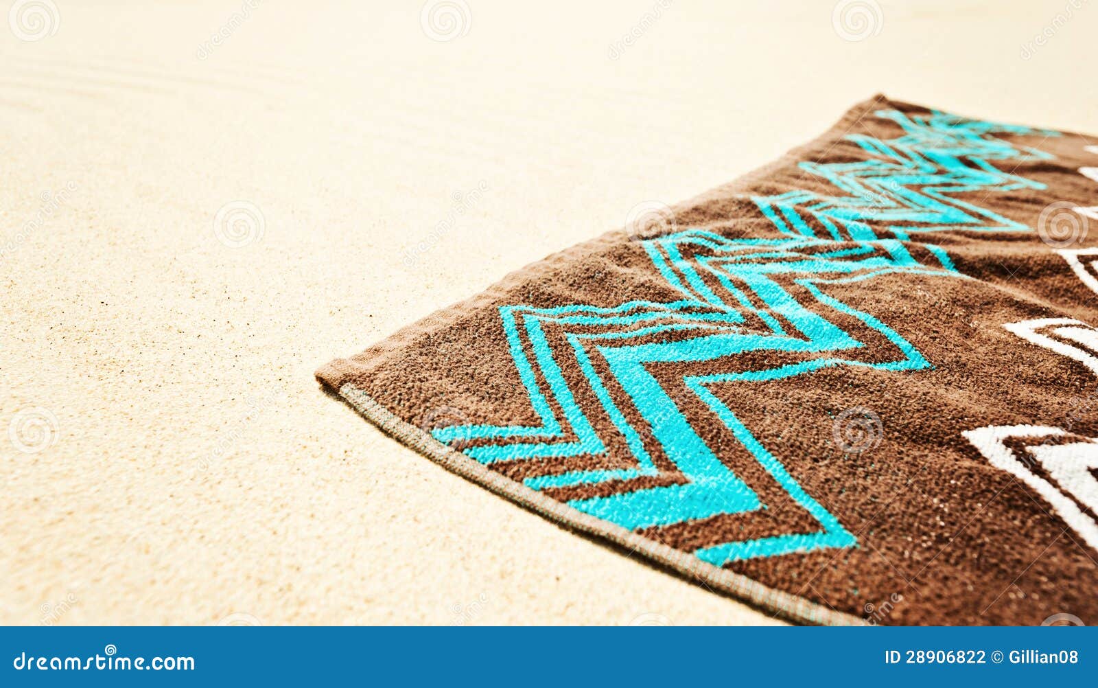 Beach towell on sand stock photo. Image of sunbaking - 28906822
