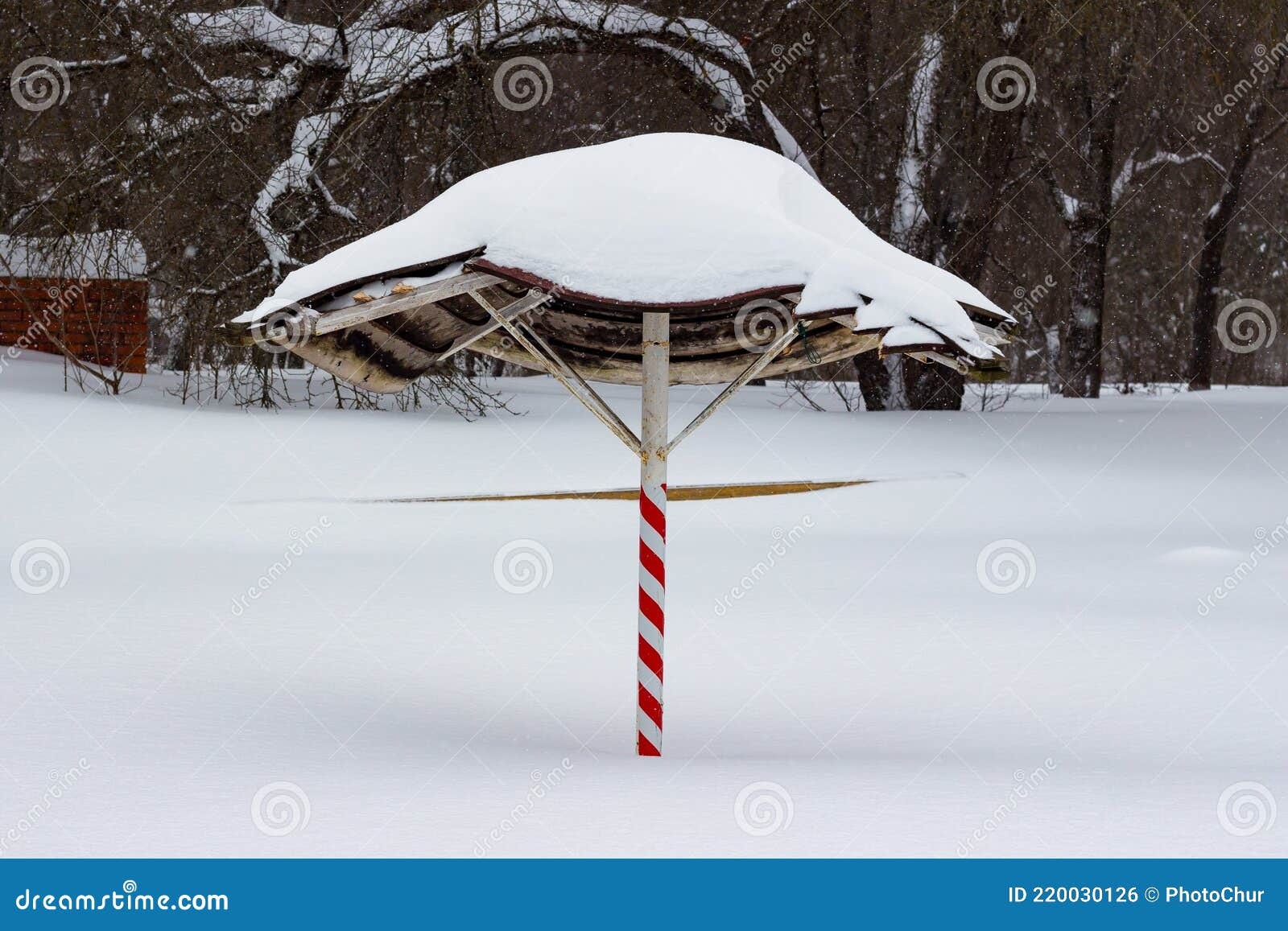 Beach Umbrella Heavily Covered with Snow during Snowfall Stock Photo ...