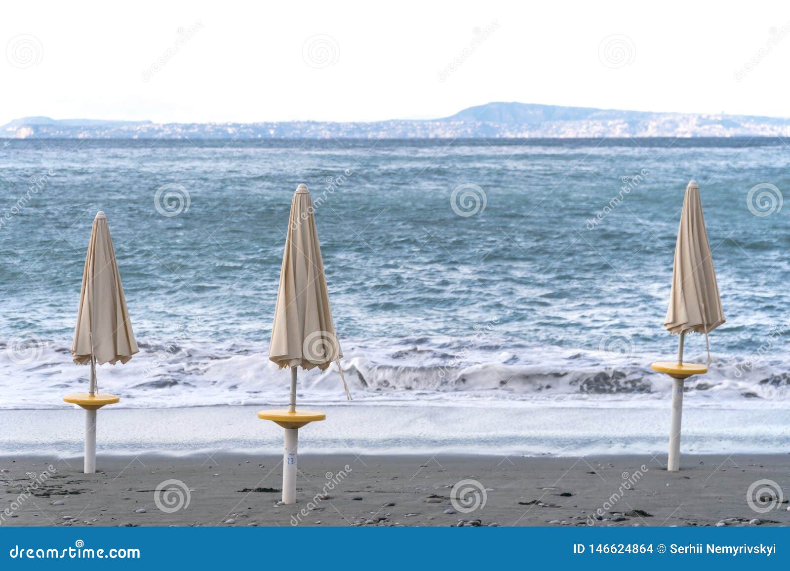 Beach Umbrellas Against the Background of Strong Waves Stock Photo ...