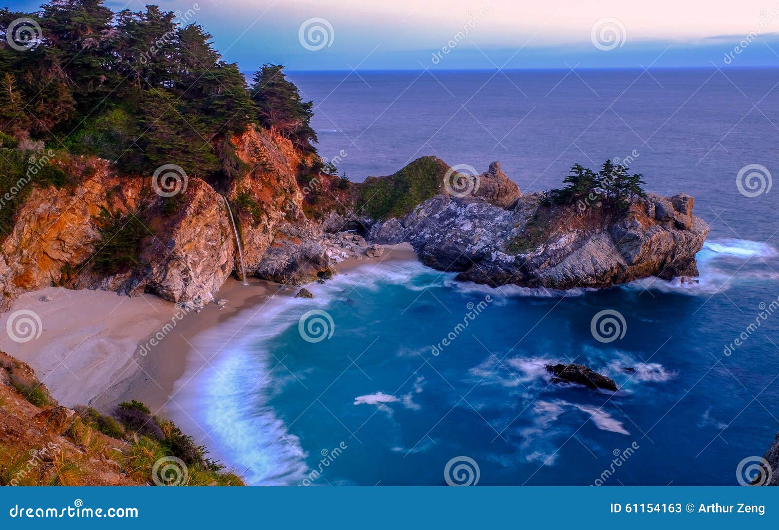 Beach water fall at dusk stock image. Image of ocean - 61154163