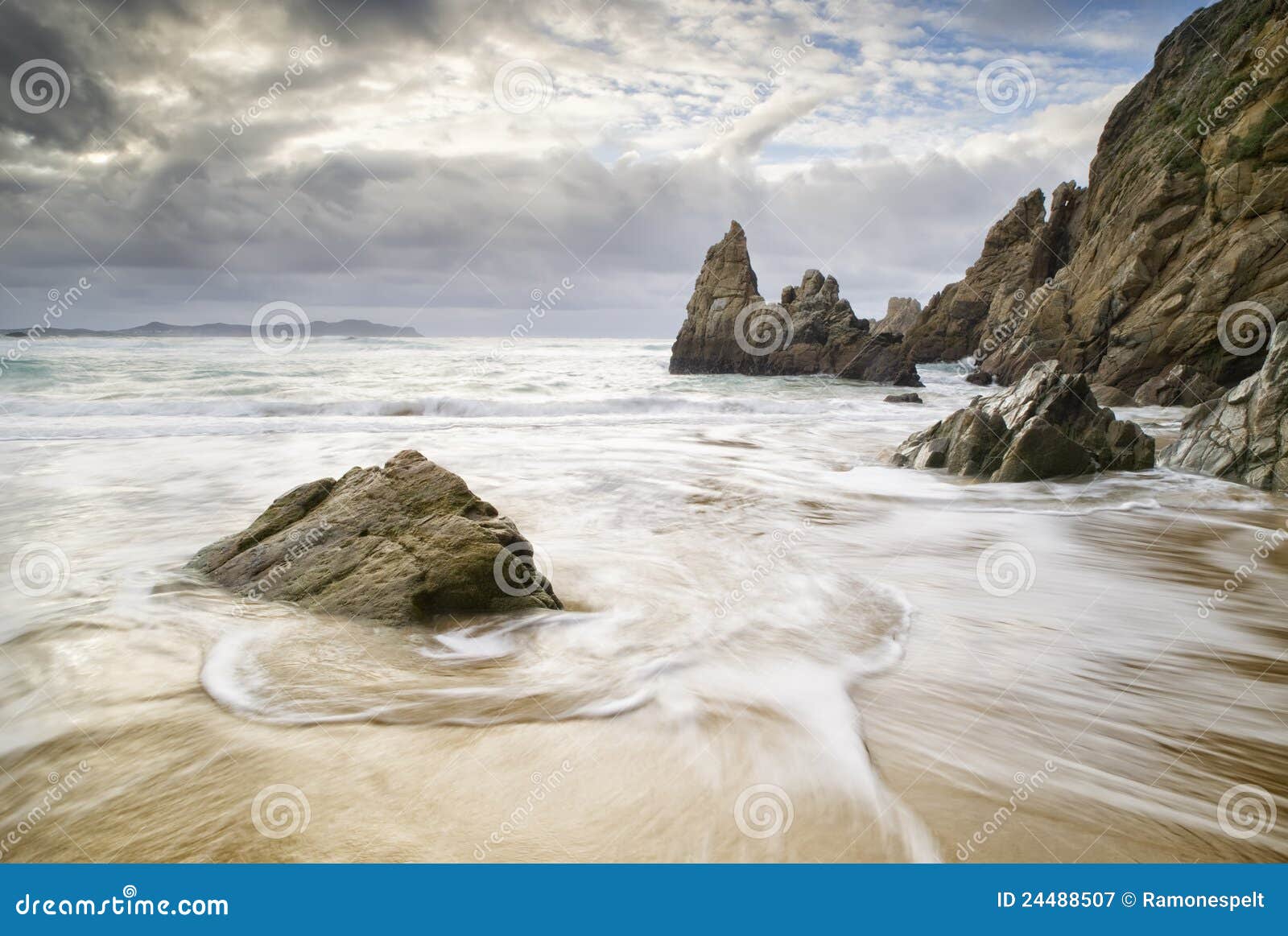 Beach with water and rocks stock image. Image of beach - 24488507