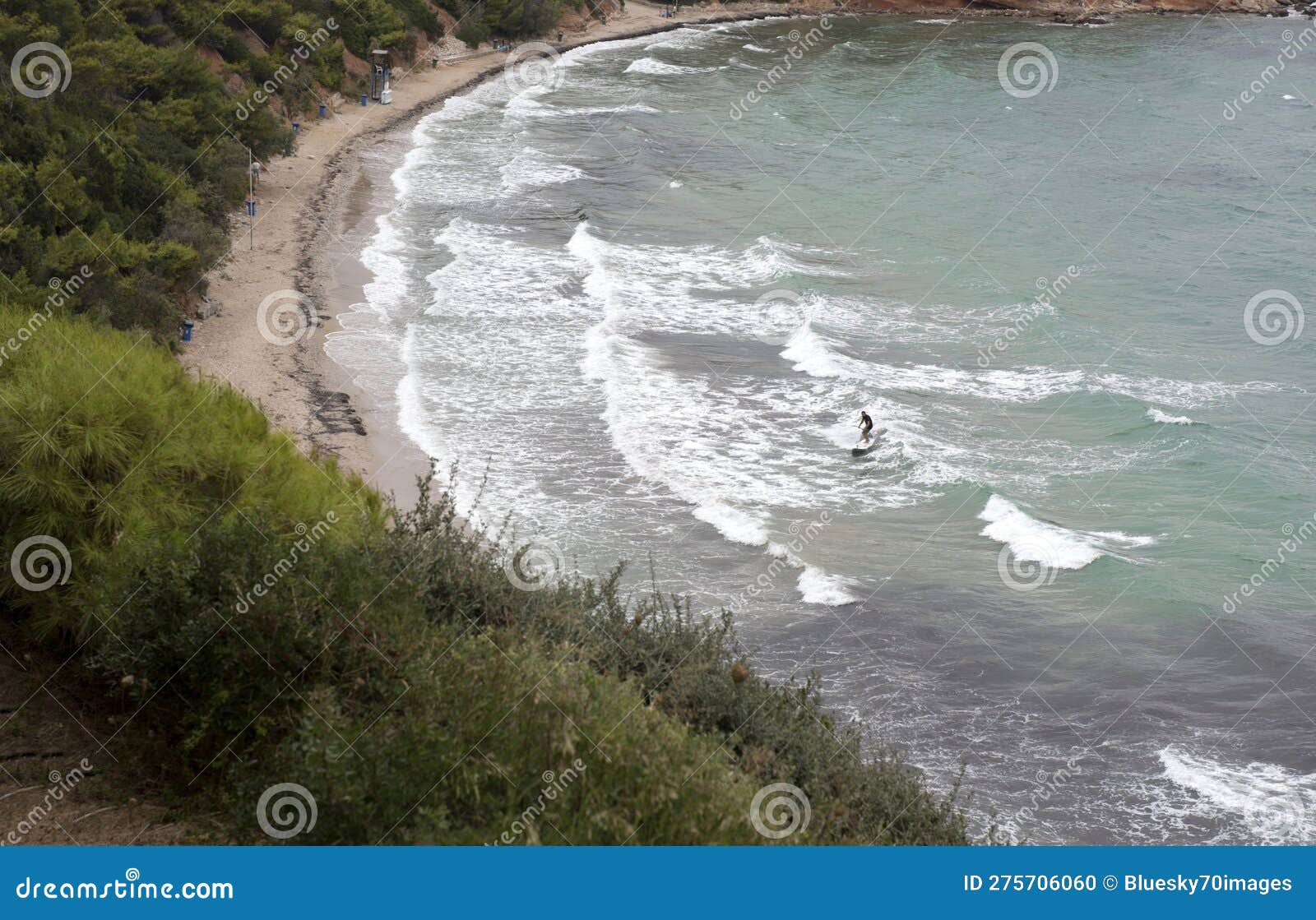 Beach with Waves and an Alone Surfer in Rafina, Greece Stock Photo ...