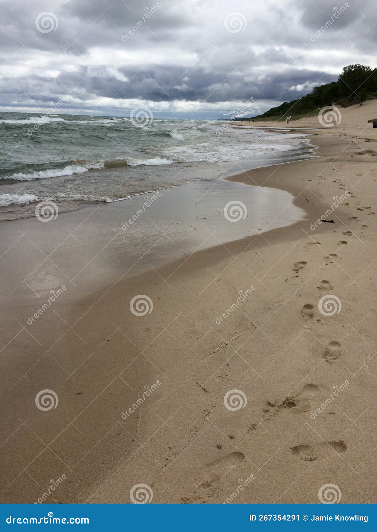 Sandy footprints stock image. Image of clouds, waves - 267354291