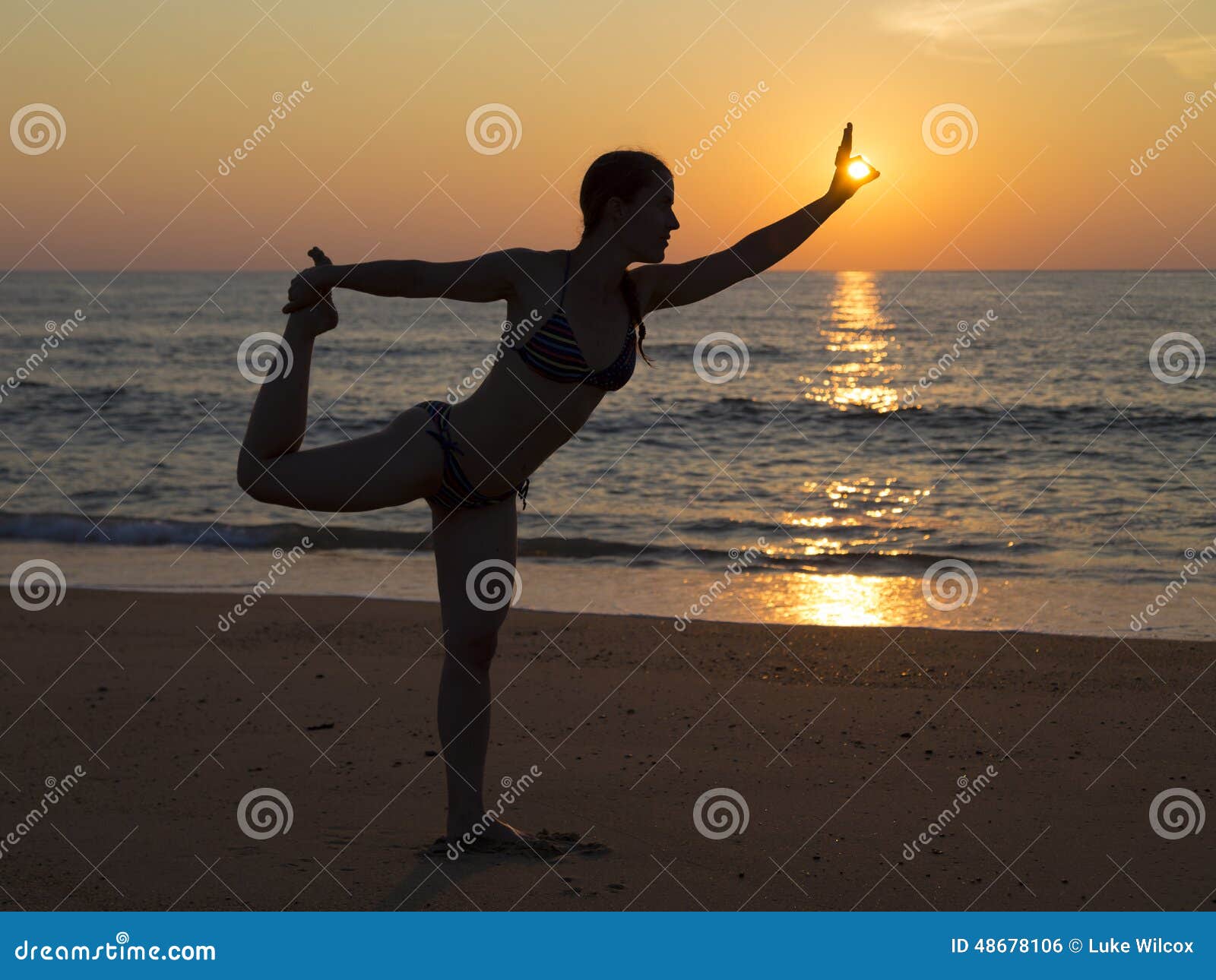 Beach yoga at sunset stock photo. Image of practice, beach - 48678106