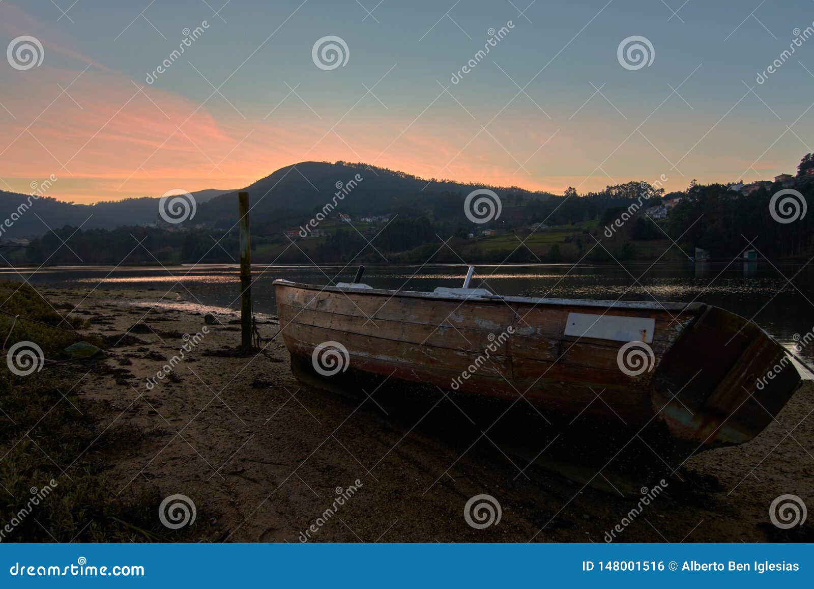 Beached boat in a sunset stock photo. Image of blue - 148001516