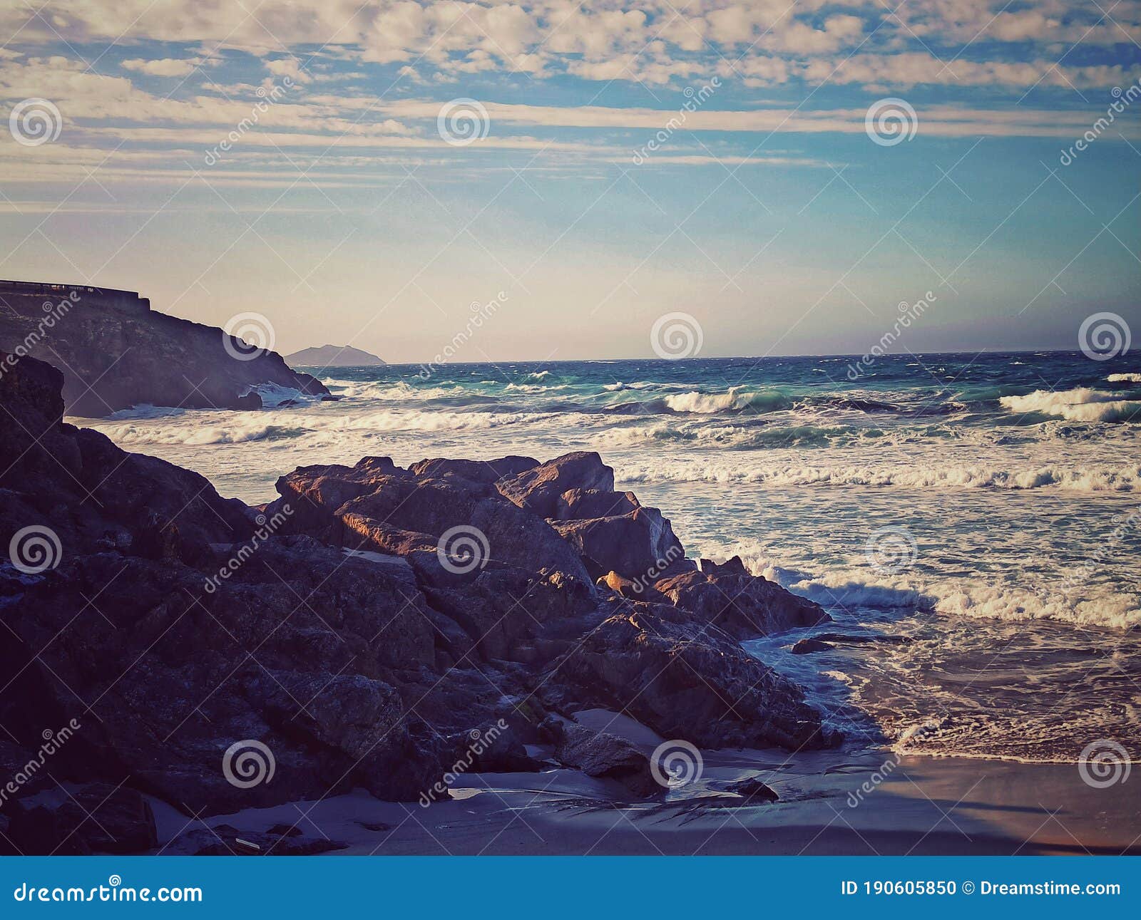 Beaches with Waves and Cliff at Sunset on the Spanish Coast Stock Photo ...