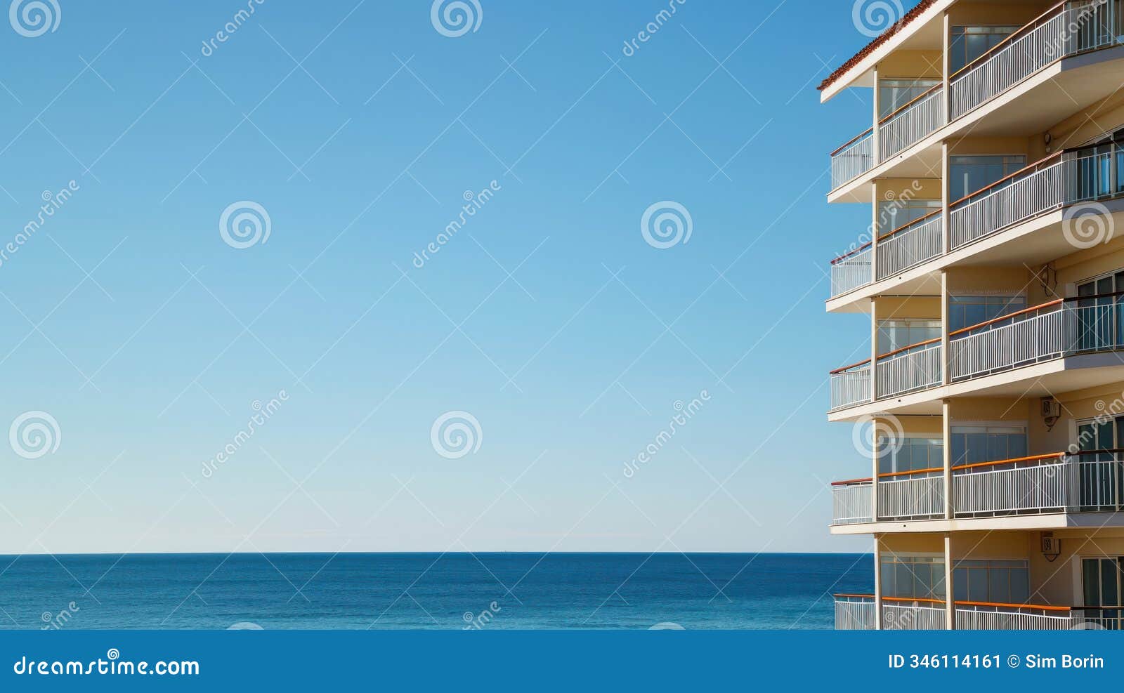 A Beachfront Hotel Exterior with Balconies Overlooking Stock ...