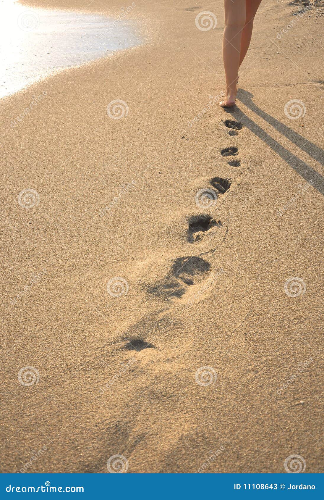 Beachwalk with footprints stock image. Image of female - 11108643