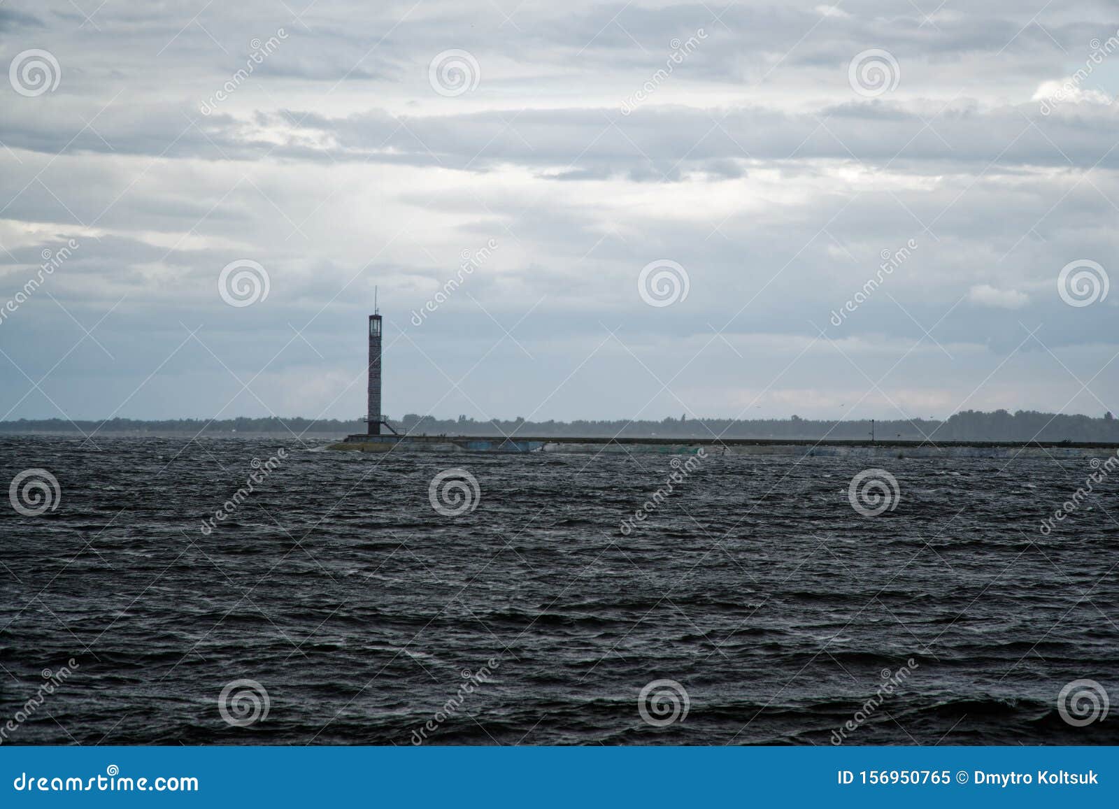 Beacon and Pier on River Calm after Storm and Strong Wind. Lighthouse ...