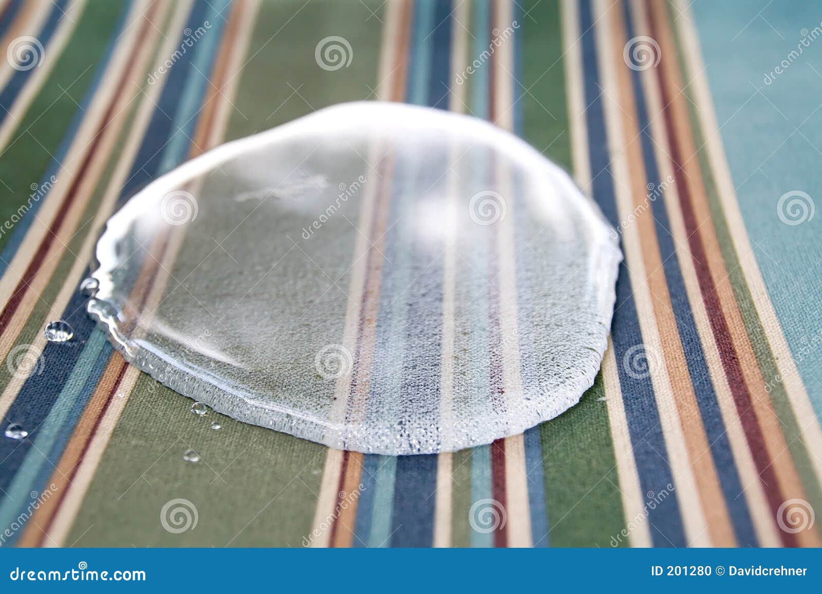 Beaded water in a puddle stock photo. Image of rainwater - 201280