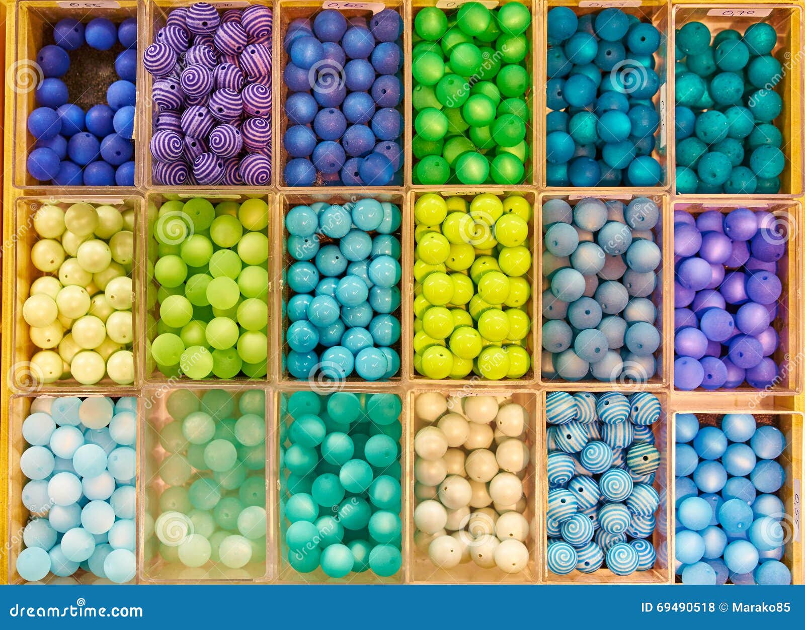 Beads in boxes stock photo. Image of bits, gold, grid - 69490518