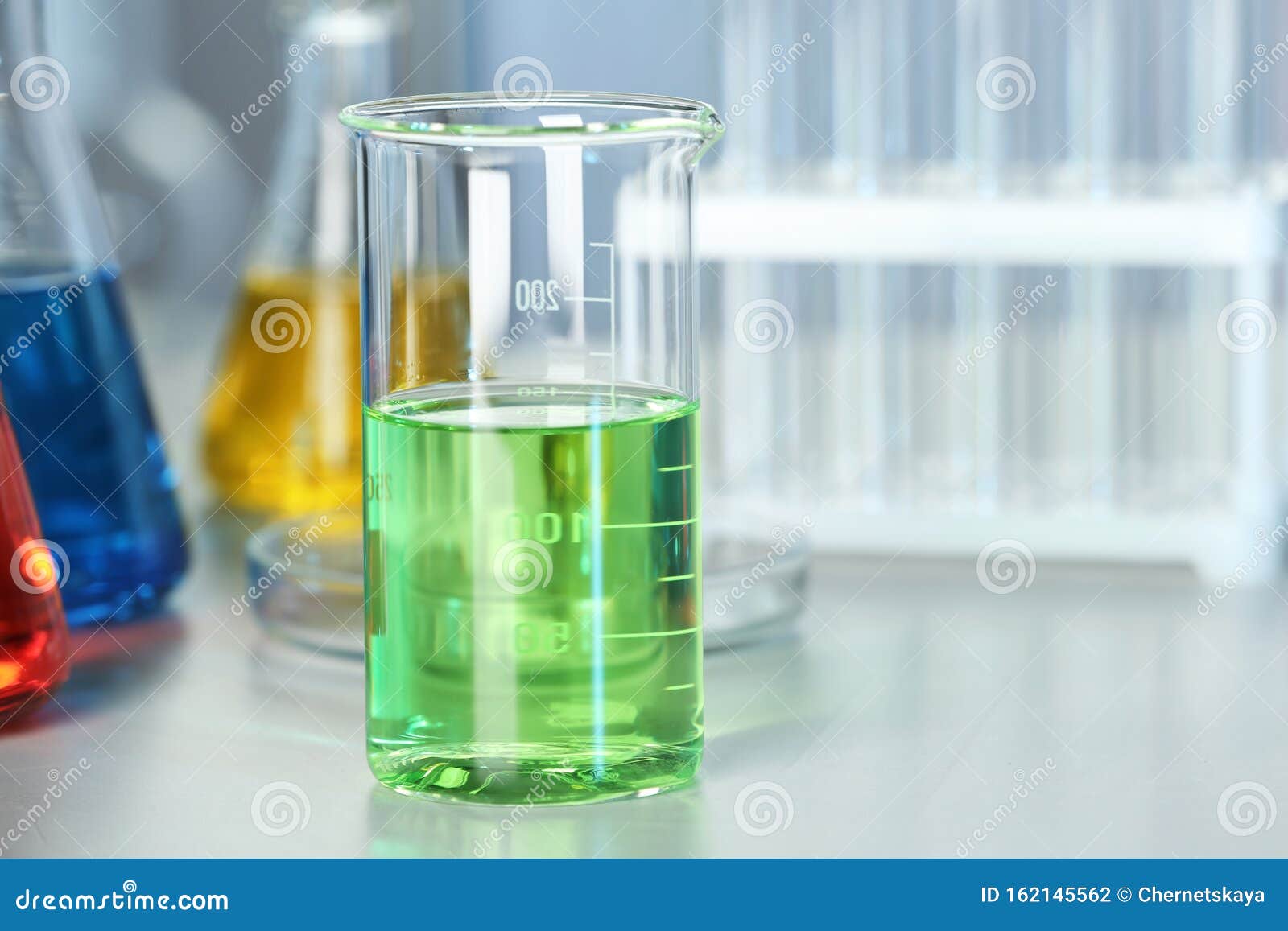 Beaker with Colorful Liquid on Table Stock Photo - Image of color ...