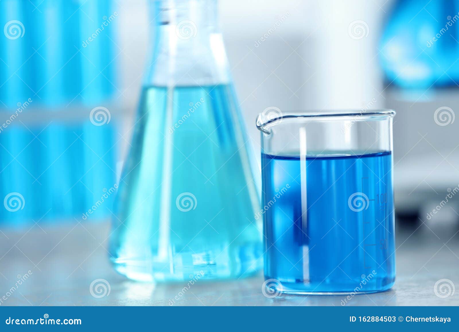 Beaker with Light Blue on Table in Laboratory. Space for Text Stock ...