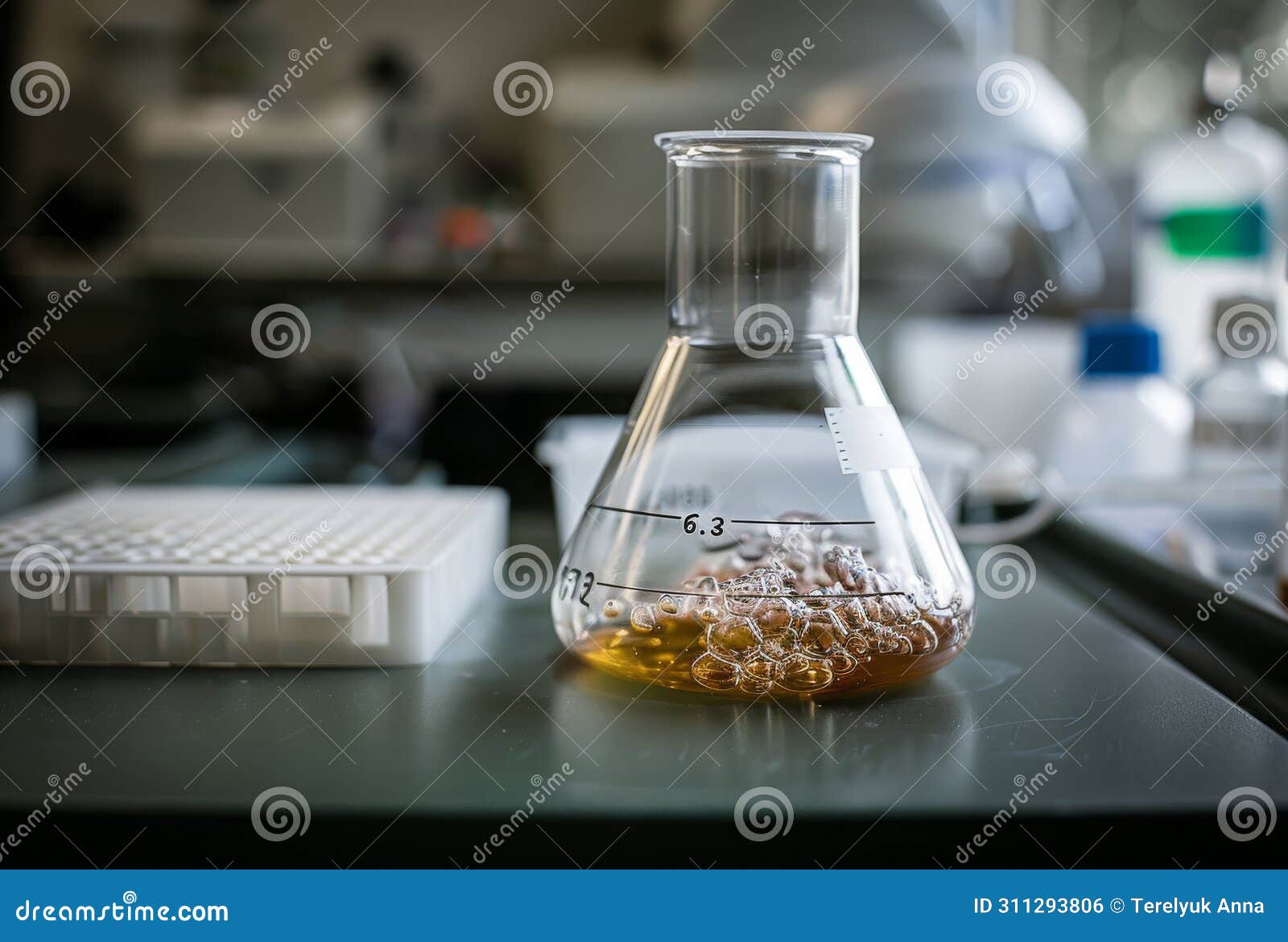Beaker Sits on Lab Bench with Computer Keyboard and Other Lab Equipment ...