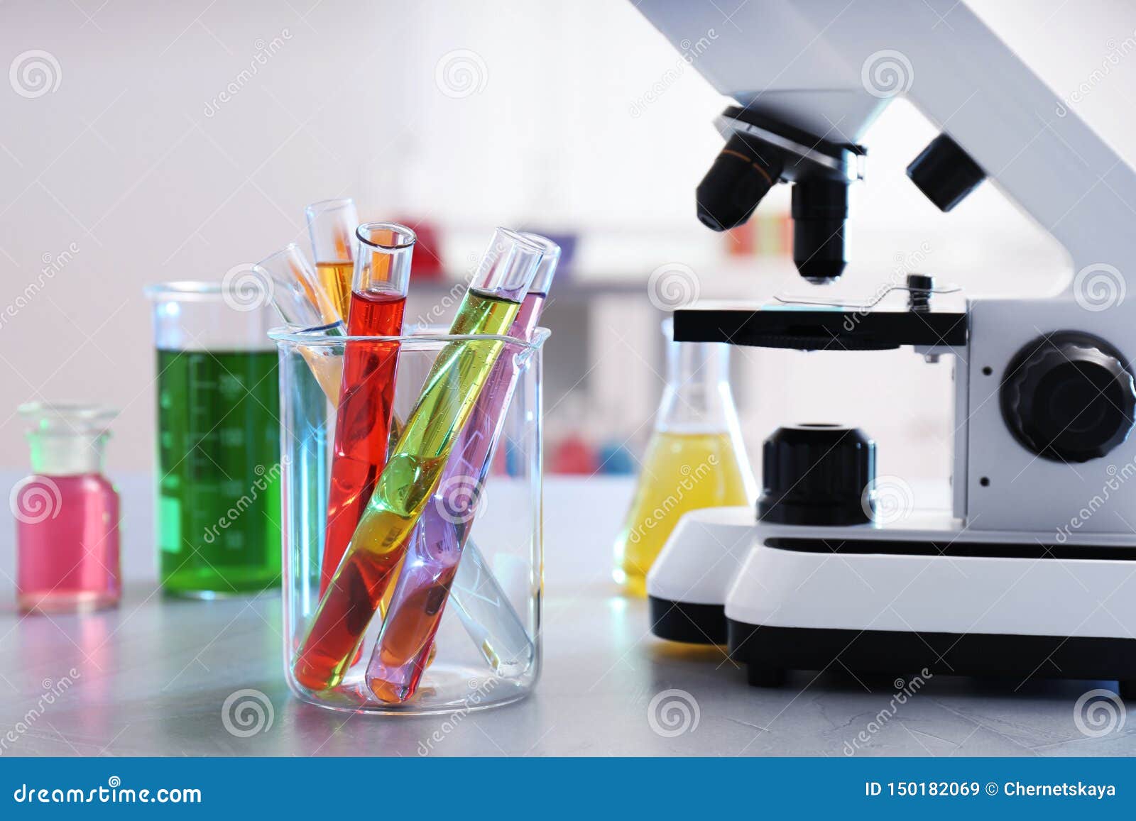Beaker with Test Tubes Near Microscope. Chemistry Glassware Stock Image ...