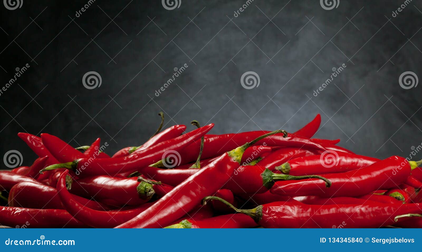 Beam of Red Chilli Pepper on Black Background. Stock Photo - Image of ...