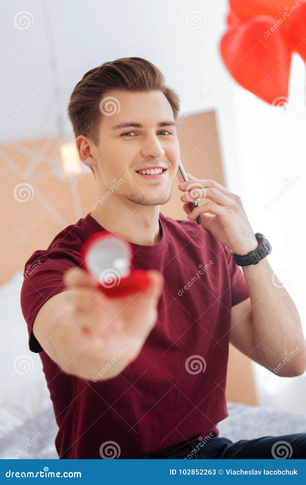 Beaming Guy Showing Proposal Ring during Phone Conversation Stock Image ...