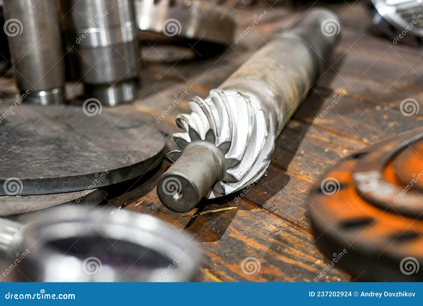 On the Beams Lies a Long Helical Gear after Processing in a CNC Machine ...