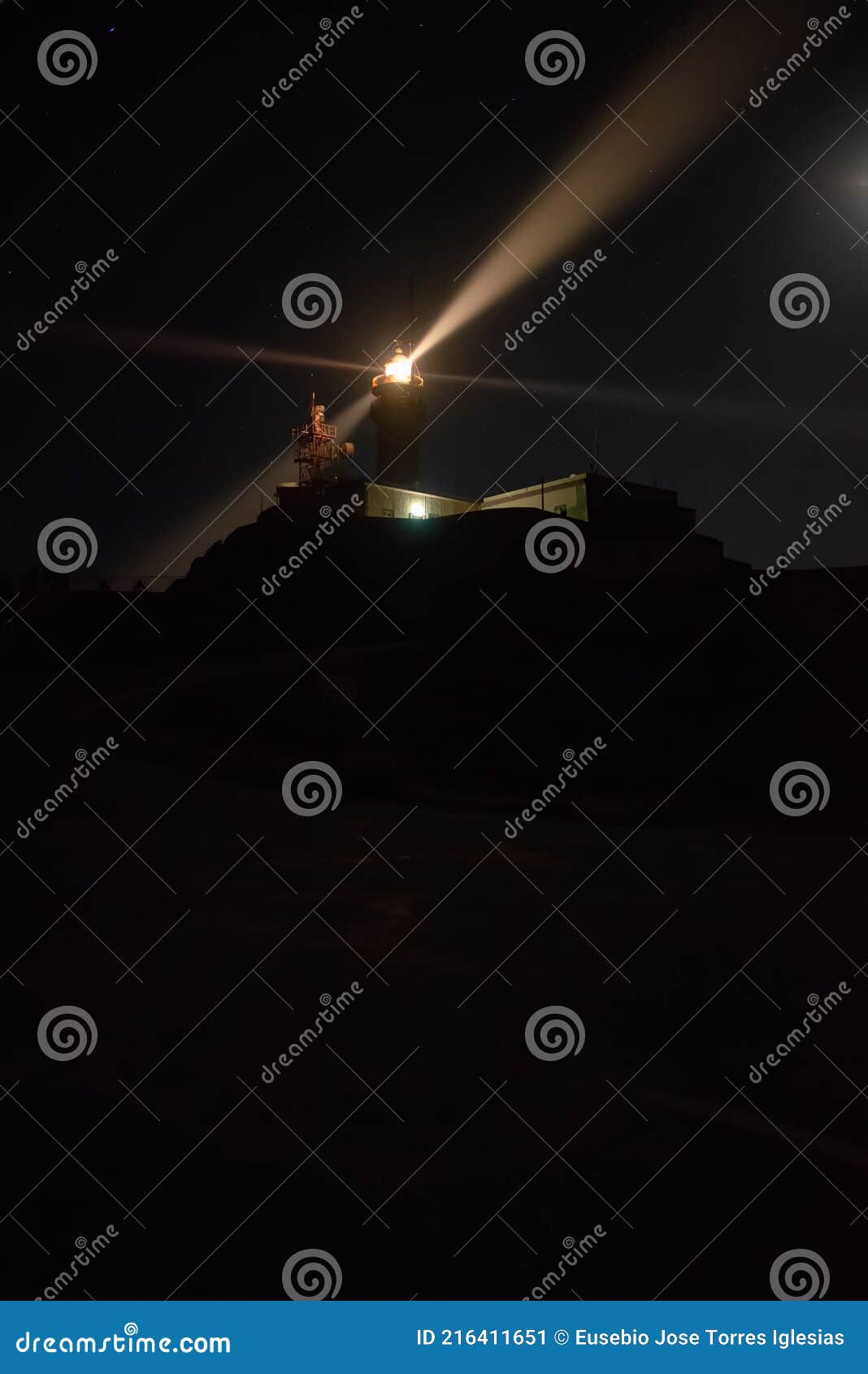 Beams of Light from a Lighthouse at Night Stock Image - Image of dusk ...