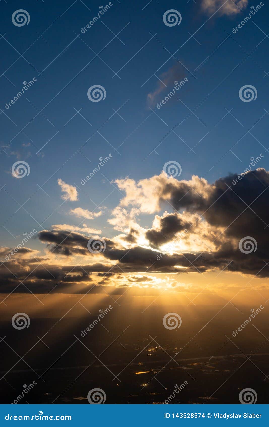 Beams of Sun Going through Cloud Onto Evening Land Stock Photo - Image ...
