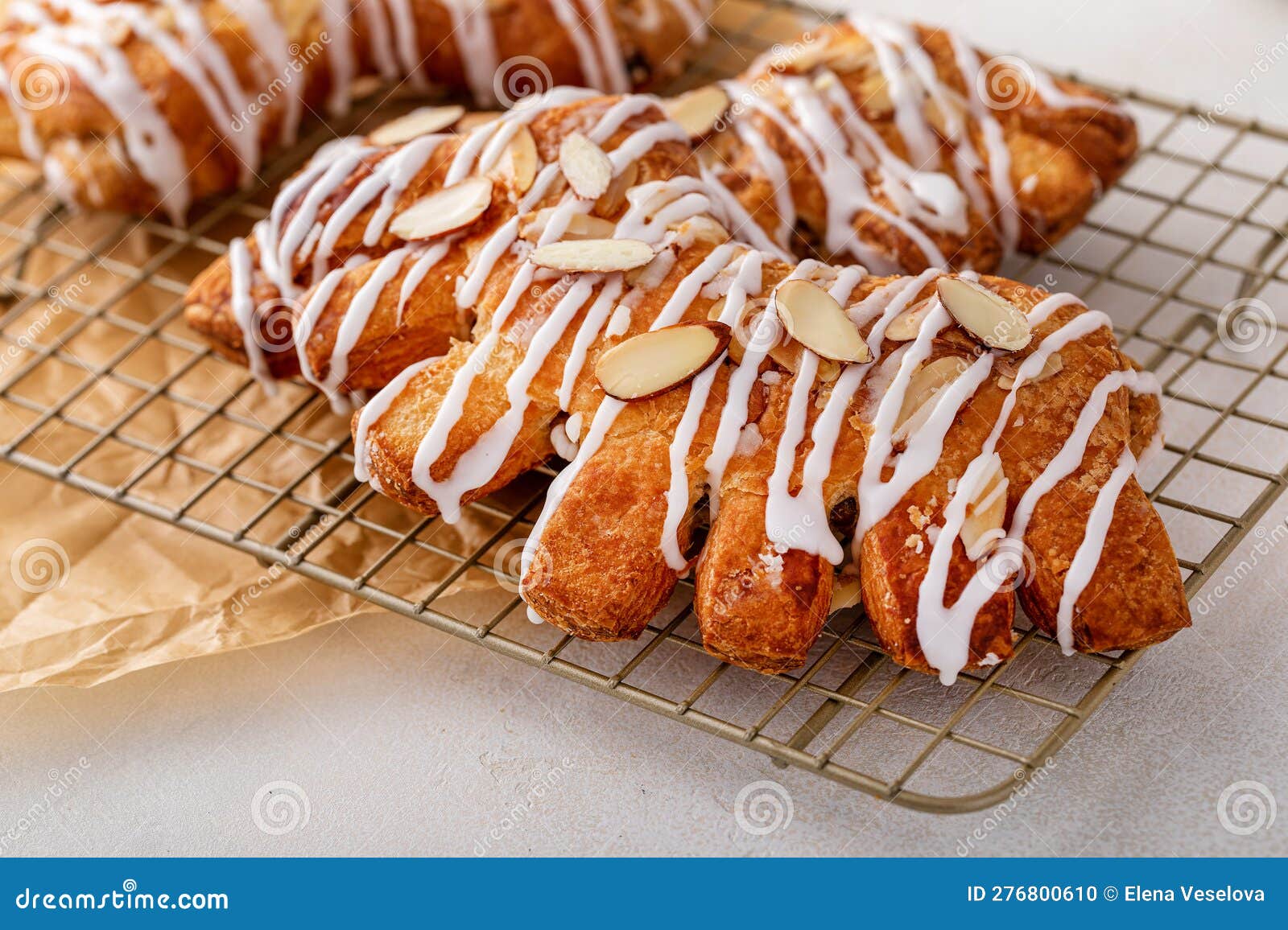 Bear Claw Pastry on a Cooling Rack with Glaze and Almonds Stock Photo ...