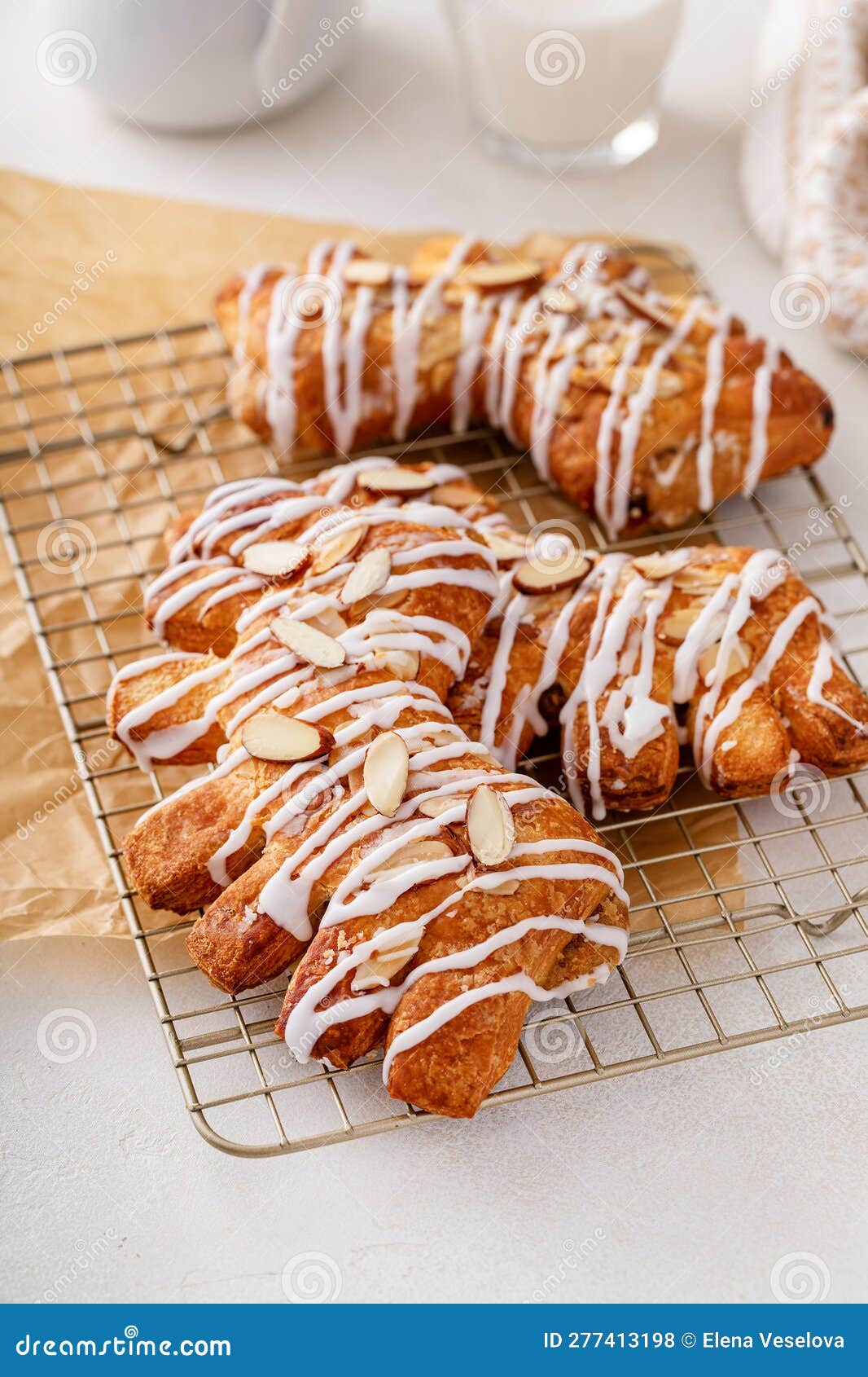 Bear Claw Pastry on a Cooling Rack with Glaze and Almonds Stock Photo ...