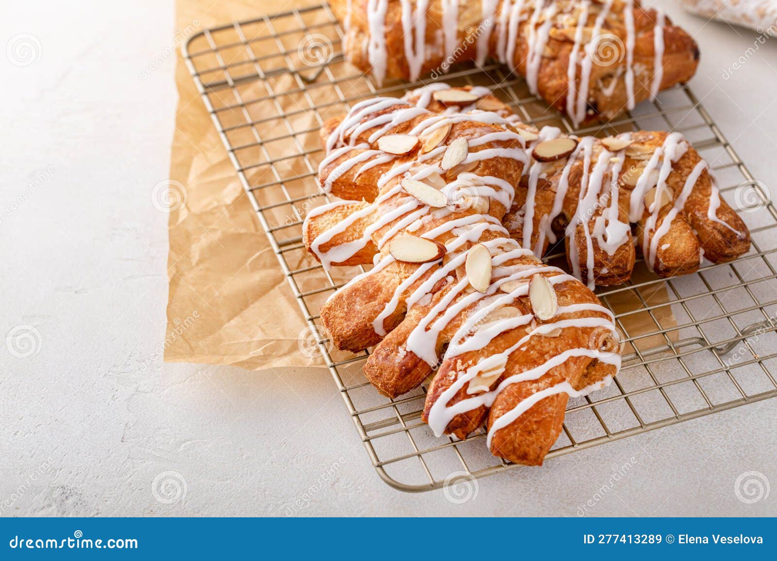 Bear Claw Pastry on a Cooling Rack with Glaze and Almonds Stock Image ...