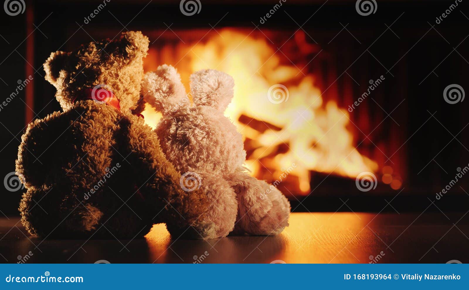 Bear and Rabbit in a Hug Sit by the Fireplace. Valentine`s Day Concept ...