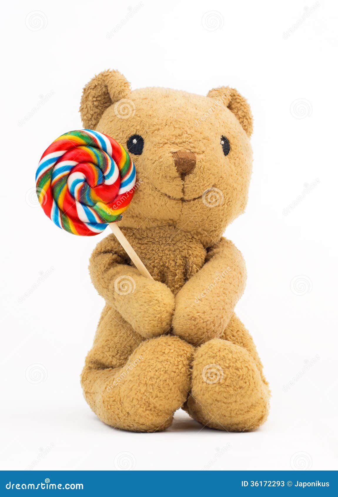Bear toy holding lollipop stock image. Image of front - 36172293