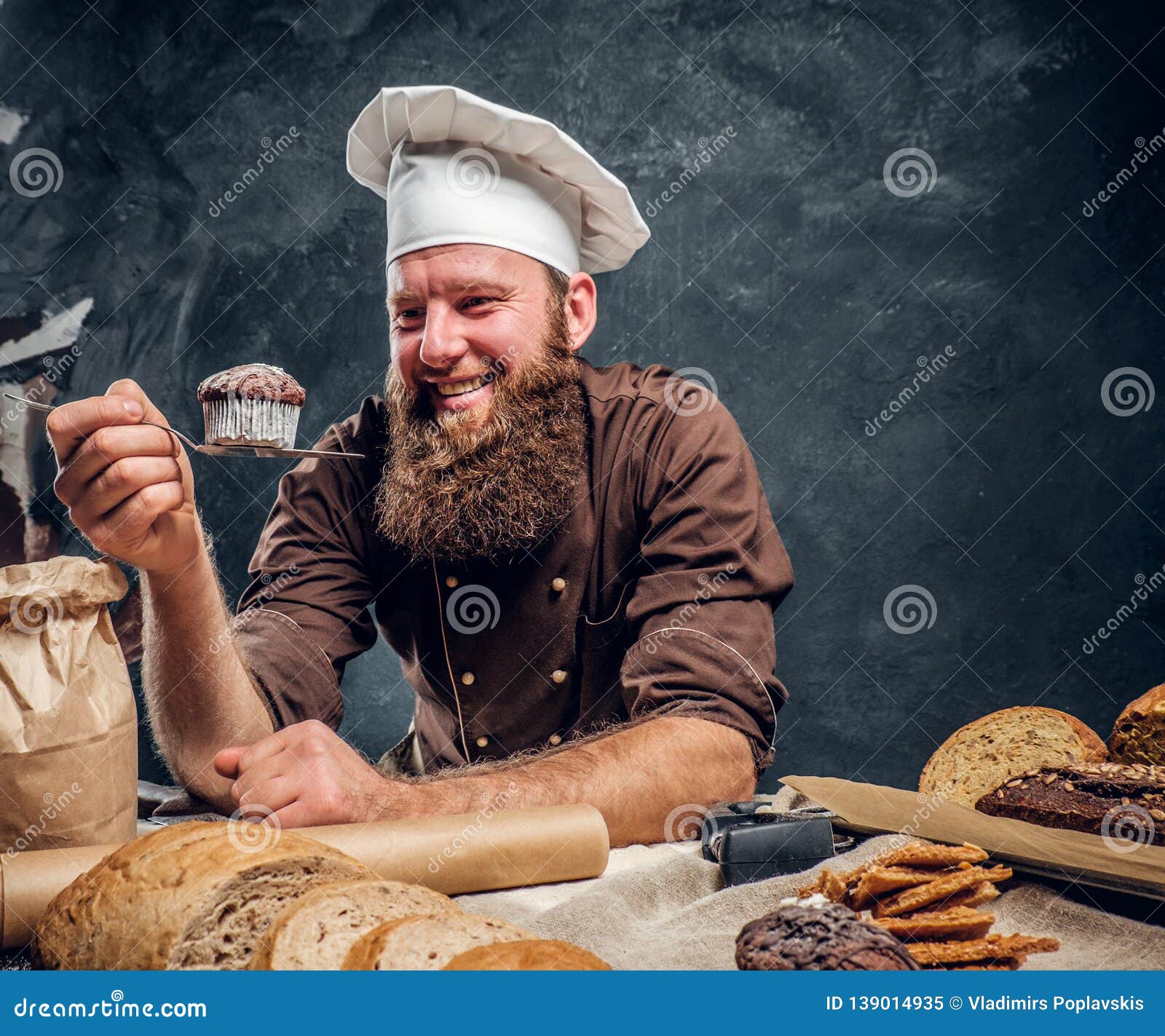 Bearded Baker Happy with His Work, Looking at His Freshly Made Muffin ...