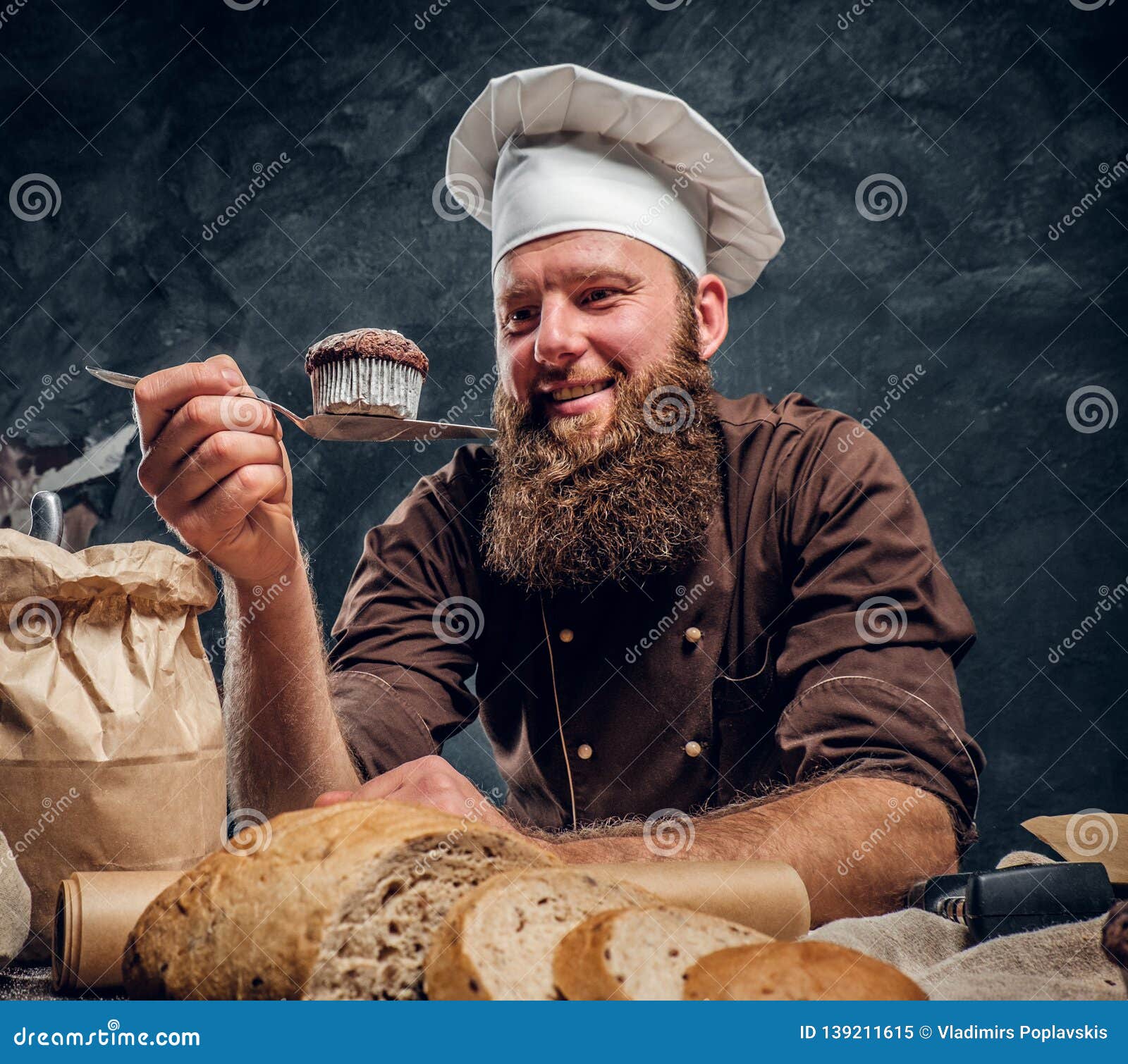 Bearded Baker Happy with His Work, Looking at His Freshly Made Muffin ...