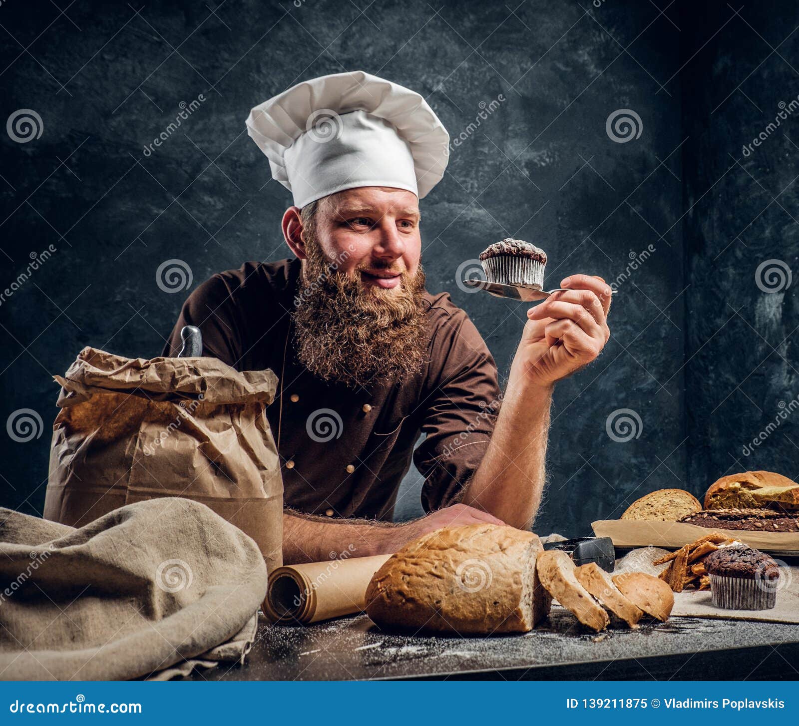 Bearded Baker Happy with His Work, Looking at His Freshly Made Muffin ...