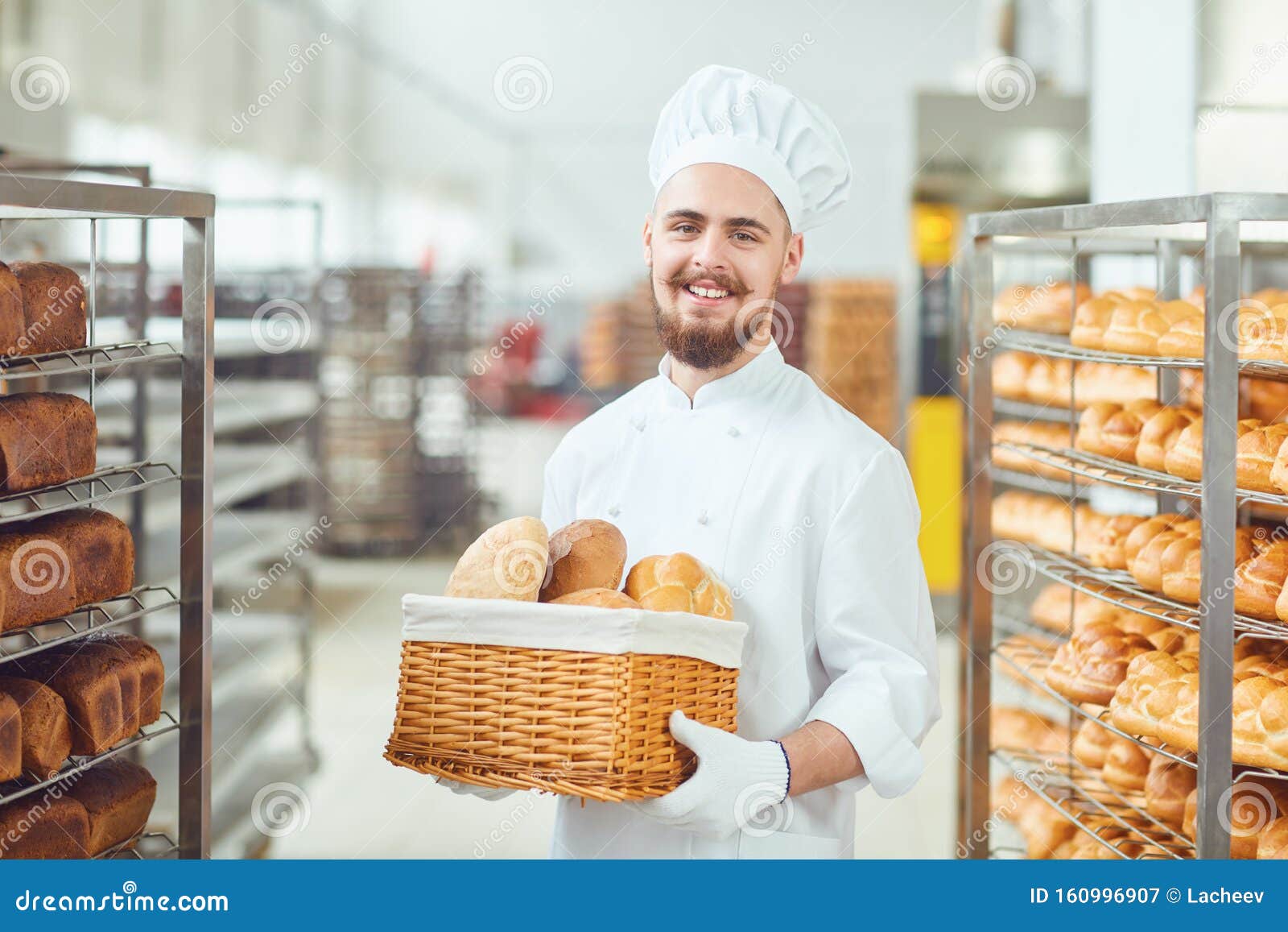 Bearded Baker Smiles Holding a Basket of Bread at the Bakehouse Stock ...